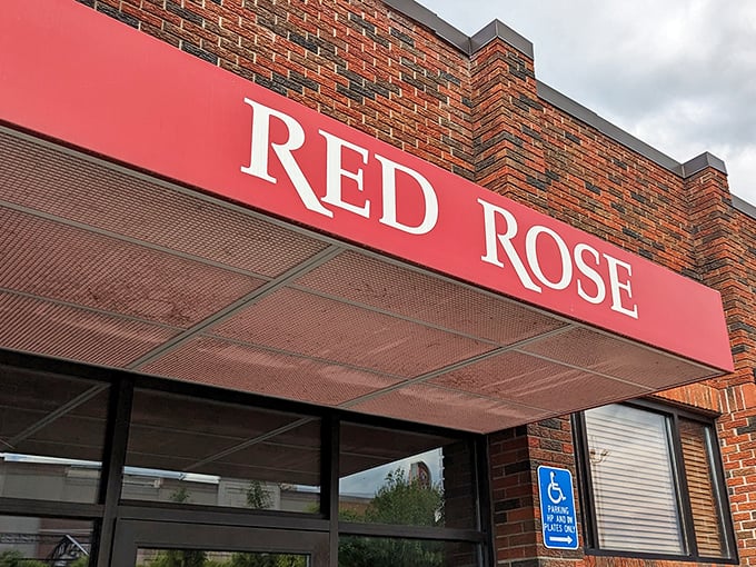 The iconic Red Rose sign welcomes pizza lovers to this Springfield institution where legendary pies await.