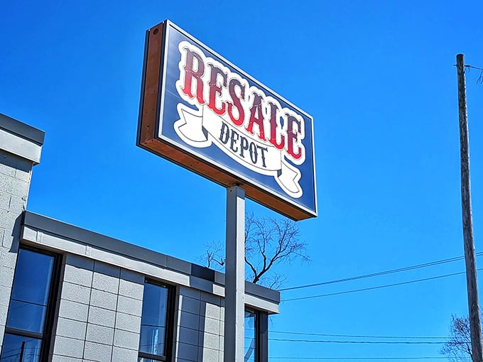 Resale Depot's vintage sign stands proud against Michigan's blue sky, a beacon for bargain hunters with champagne taste on a beer budget.