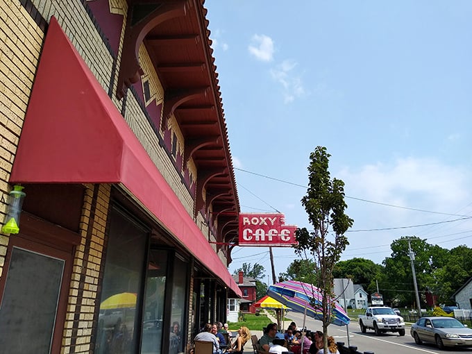 Roxy Cafe (exterior): That vintage red awning isn't just decoration&mdash;it's a beacon for breakfast lovers. The sidewalk seating screams "summer in Michigan done right!"