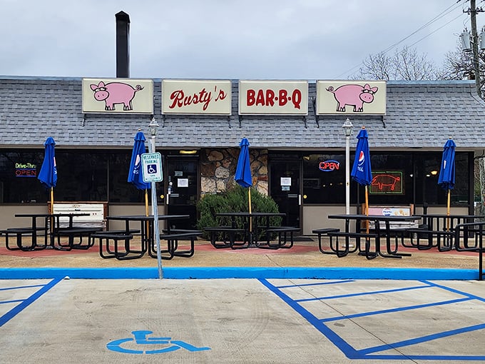 Blue umbrellas and picnic tables at Rusty's create the perfect setting for that moment when sauce inevitably drips down your chin.