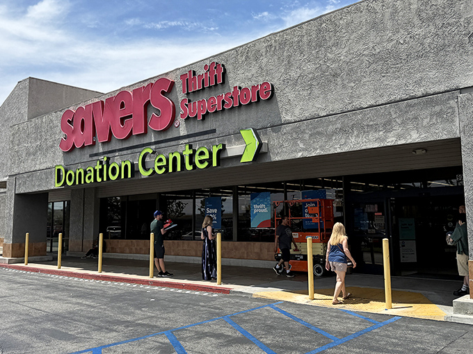 Savers' bold red and green signage welcomes thrift hunters to a wonderland of pre-loved possibilities. The donation center entrance promises new treasures daily.