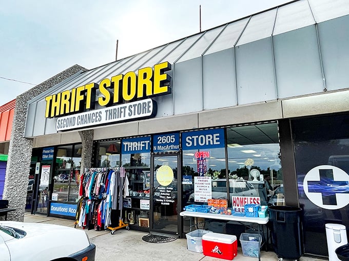 Second Chances' bold yellow sign is like a beacon for bargain hunters. Those racks inside are calling your name!