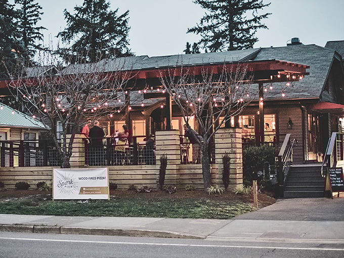 Spark Pizza under twinkling lights creates the perfect setting for wood-fired magic when evening falls in Redmond.