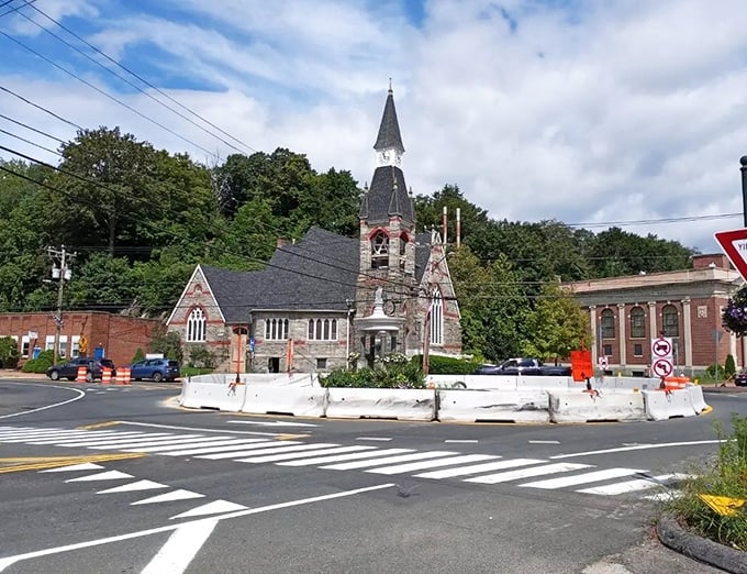 That stone church has seen more history than your high school textbook, standing proud at Stafford's central roundabout.