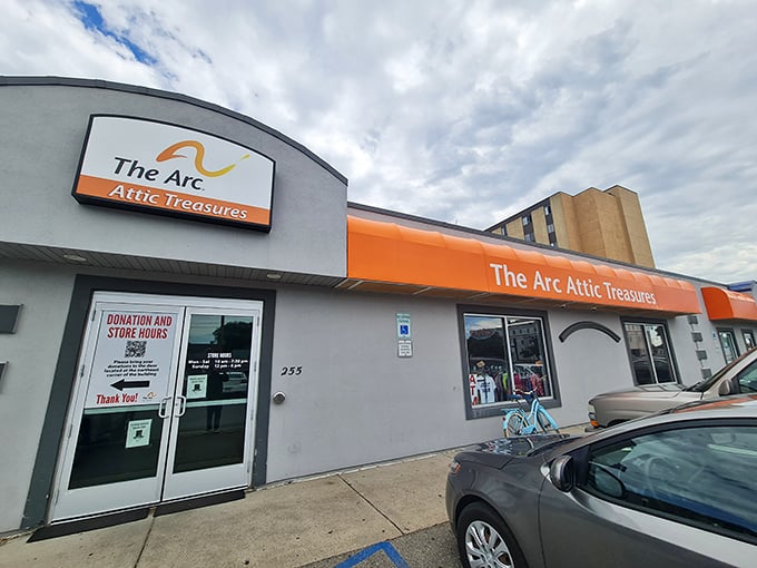 The Arc's bright orange awning signals "bargain alert" to thrifty shoppers. Like a beacon of hope for your wallet.