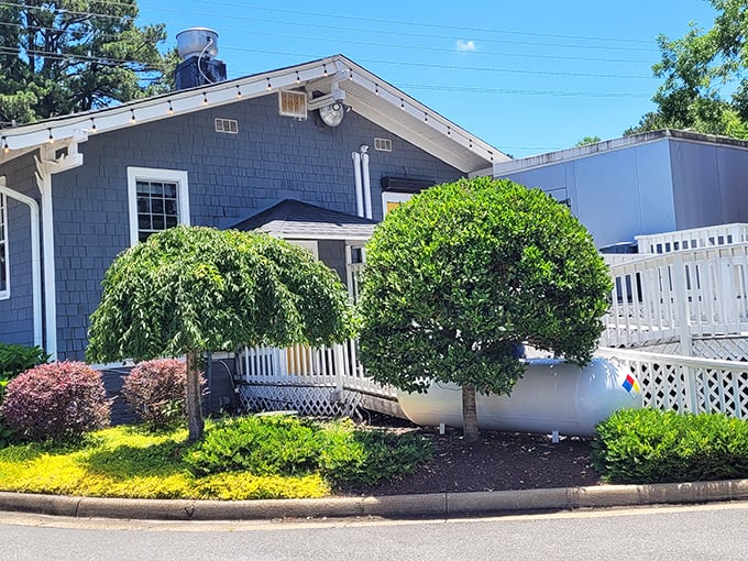 The yellow door beckons like a culinary lighthouse. This charming cottage hides comfort food that'll make you weep with joy.