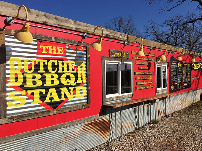 The Butcher BBQ Stand's vibrant red exterior is like a siren call to hungry travelers. Resistance is futile!