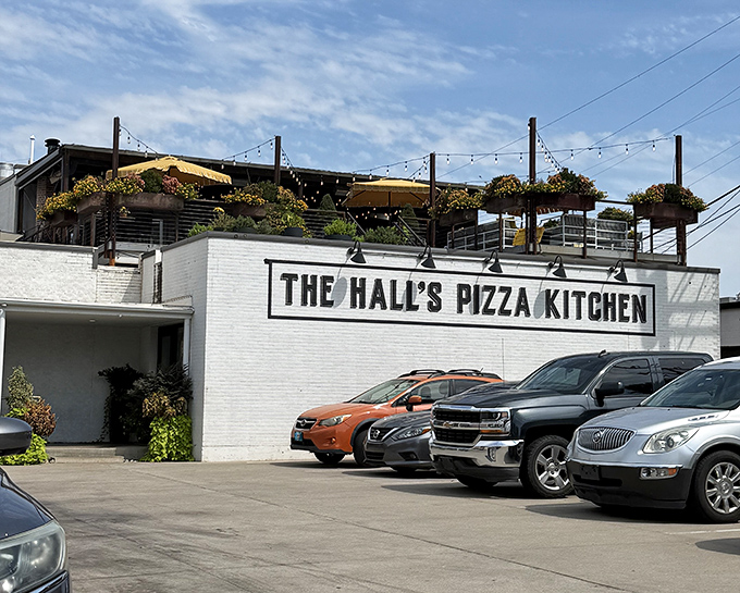 The Hall's Pizza Kitchen's rooftop dining area offers a breath of fresh air. White brick elegance meets pizza perfection in this Oklahoma City gem.