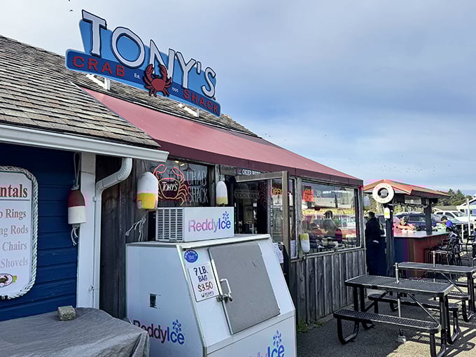 Tony's Crab Shack stands proud with its iconic red crab sign. Where seafood dreams come true in a humble blue building.