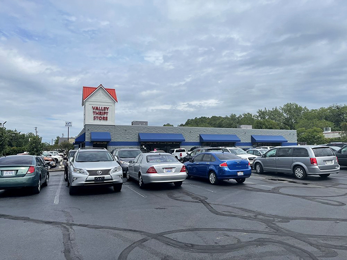 Parking lot packed with possibility! Valley Thrift's red-roofed welcome mat invites Cincinnati bargain hunters to the ultimate secondhand safari.