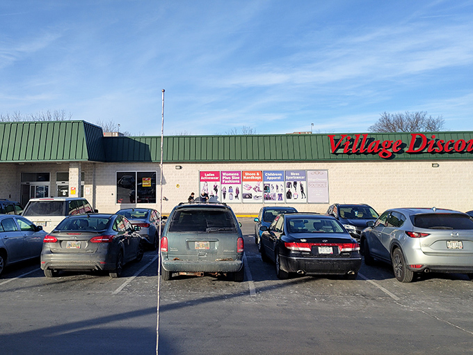 Village Discount's green roof signals "go" to bargain hunters. Like a department store from a parallel universe where everything costs less.