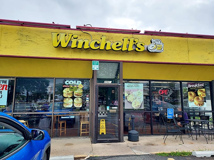 That cheerful yellow facade might not win design awards, but it signals serious donut business inside. 