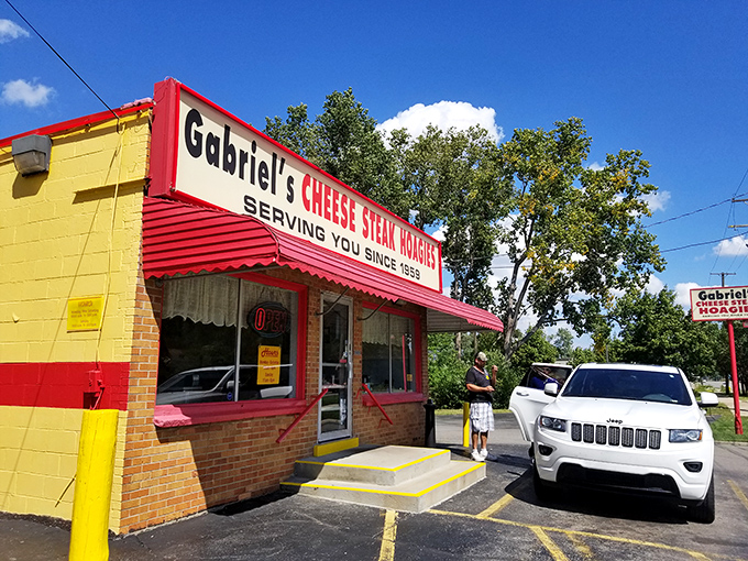 Bold red and yellow stripes announce serious sandwich business has been happening here for decades.