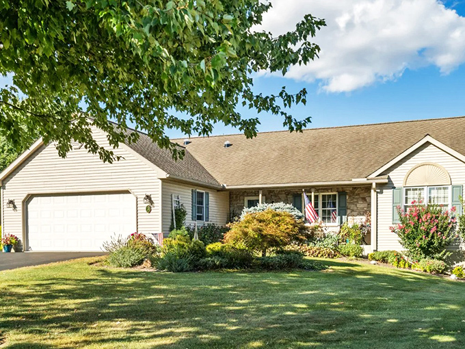 This Arbor Gate home showcases Pennsylvania charm with its stone accents and colorful landscaping. Retirement living that won't make your wallet retire early!