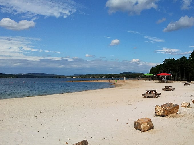 Colorful umbrellas dot the shoreline like a painter's palette against the backdrop of Arkansas's answer to paradise.