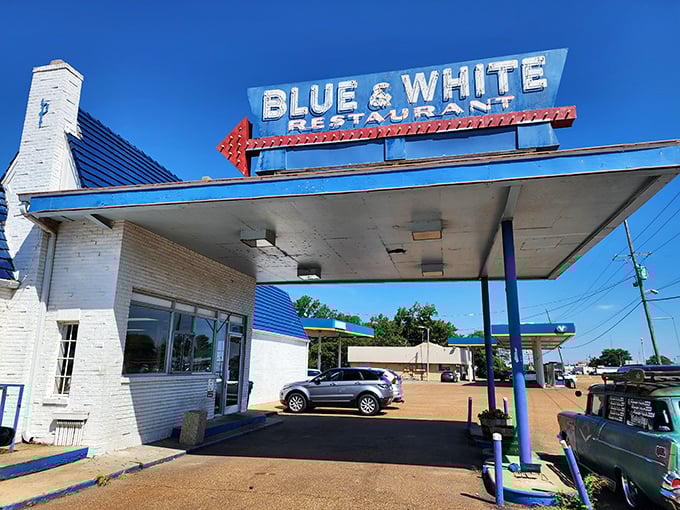 This isn't just a restaurant, it's a time machine. The Blue & White's iconic blue roof has welcomed hungry travelers for decades.