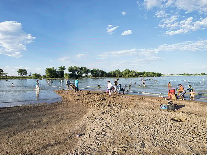 Summer's greatest hits album cover right here. Families cooling off in nature's swimming pool under Colorado’s wide-open sky.