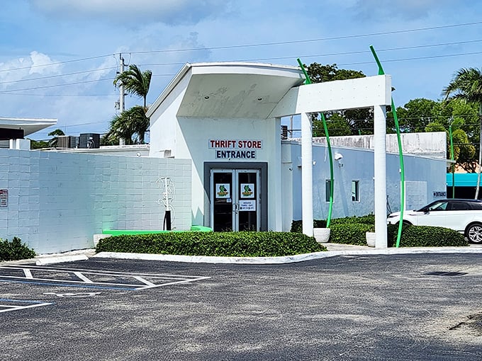 Bright Florida sunshine bounces off this pristine thrift store entrance. The palm trees nearby remind you this is bargain hunting in paradise.