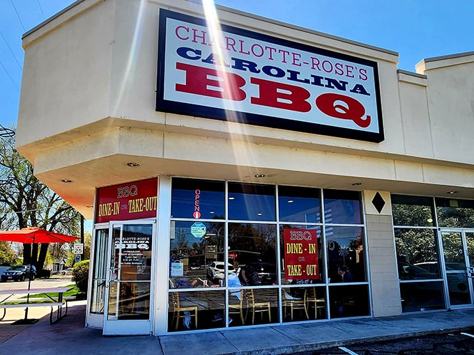 Bright and inviting, Charlotte-Rose's corner spot beckons BBQ lovers. That red, white, and blue sign is practically a beacon for hungry travelers.