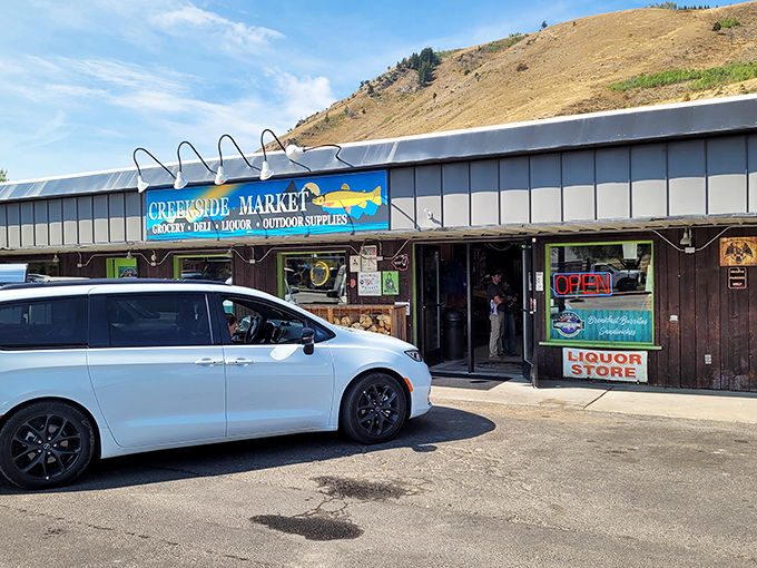 The blue fish sign of Creekside Market beckons outdoor enthusiasts who know good sandwiches fuel great adventures.