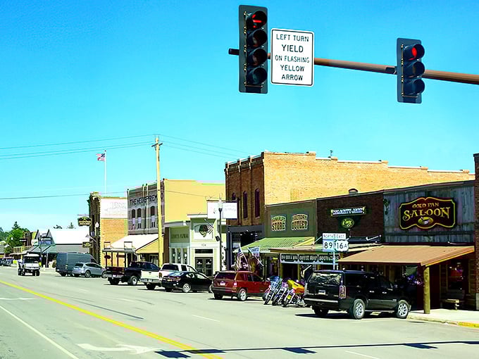 This classic small-town streetscape proves that sometimes the best entertainment is simply watching life unfold at its own pace. 