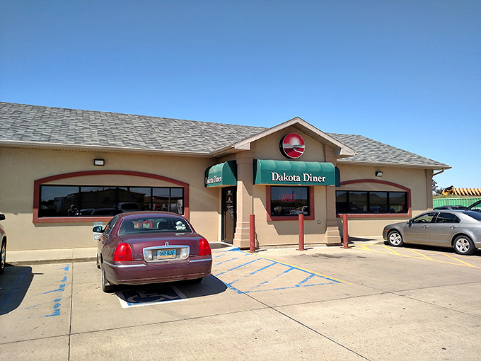 Under clear blue skies, Dakota Diner beckons with the silent promise of hash browns that could make a grown adult weep with joy.