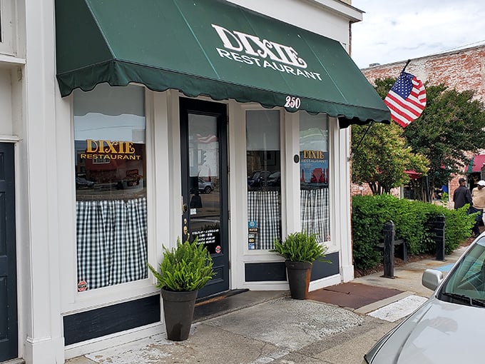Behind these checkered curtains lies a time machine disguised as a diner, serving nostalgia on every plate.
