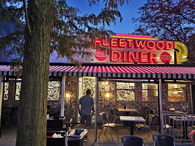 As night falls, Fleetwood's neon sign transforms into a midnight beacon, calling to hungry night owls and early risers alike.