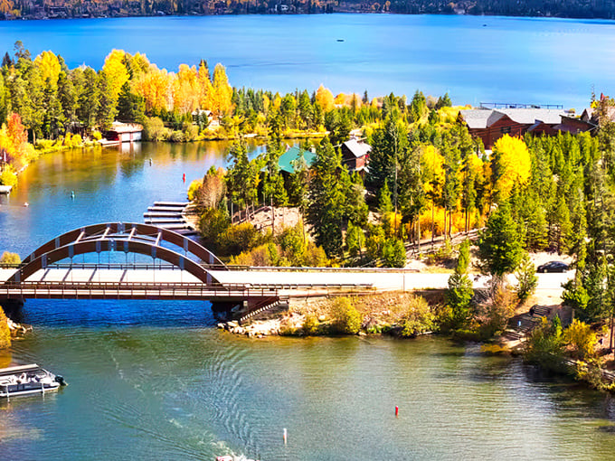 Golden aspens frame the water like nature's own picture frame, with a bridge that practically begs for a romantic stroll.