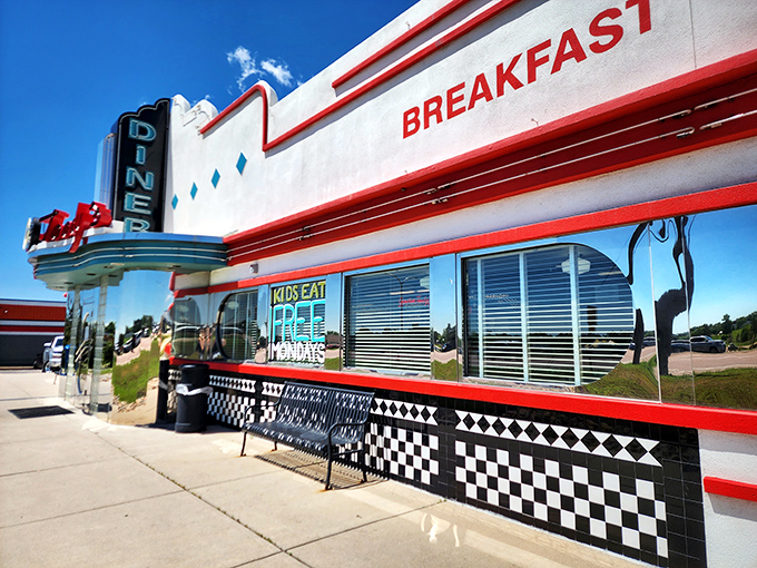 Blue skies, red trim, and a sign that practically shouts "BREAKFAST!" This diner knows exactly what you're craving before you do.