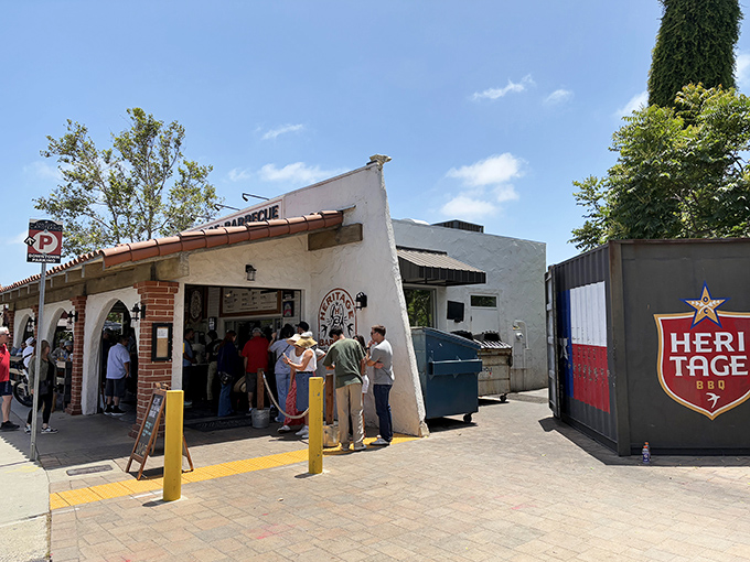 The sight of patient barbecue lovers gathering speaks volumes about the smoky goodness awaiting inside.