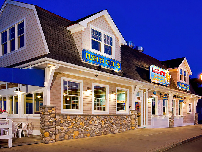 As the evening lights glow, this doughboy destination transforms into a beacon for seafood lovers seeking comfort by the shore.