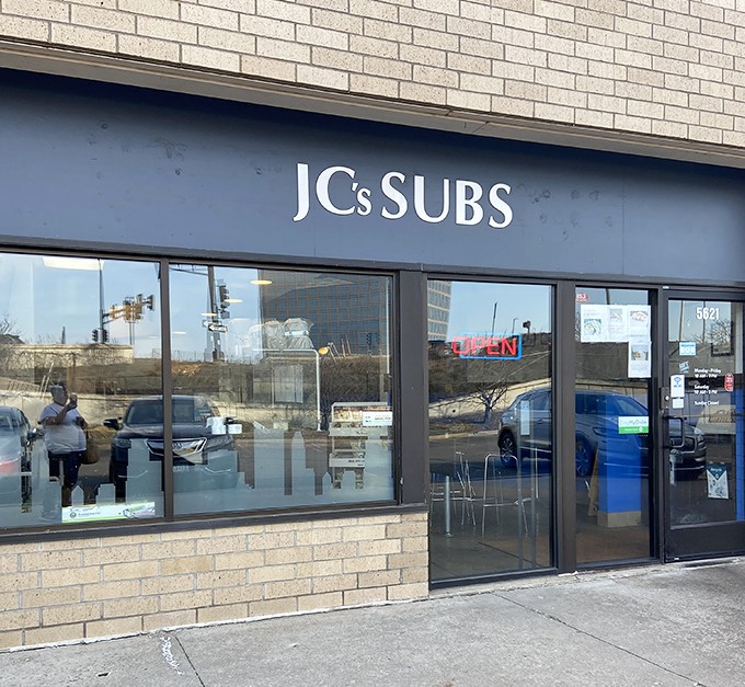 The unassuming storefront of JC's Subs hides sandwich greatness within those brick walls. Don't judge this book by its cover.