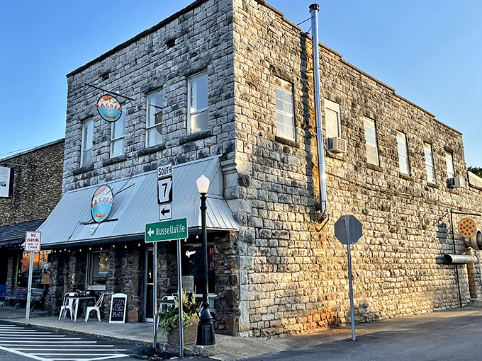 As the sun sets on downtown Jasper, this historic stone building beckons with promises of bubbling cheese and perfect crust.