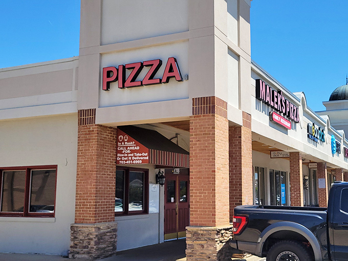 That simple "PIZZA" sign says everything and nothing, which is exactly how the best neighborhood joints roll.