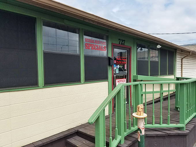 A closer look at Mill Street Diner's entrance showcases their famous breakfast steaks sign and the cozy, unpretentious atmosphere locals love.