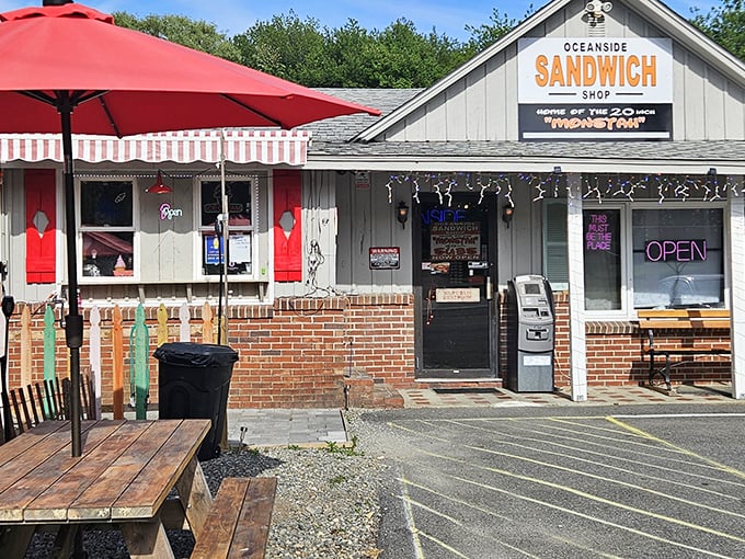 Summer sandwich paradise with that red umbrella offering shade while you demolish Oceanside's legendary creations.