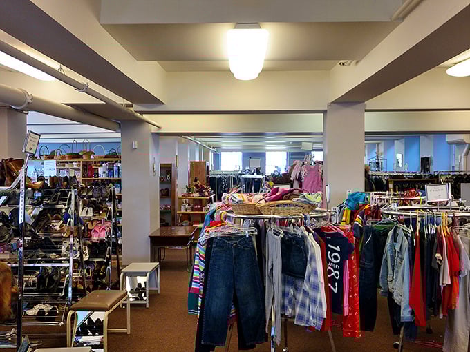 Racks of colorful clothing stretch across Outfitters' spacious interior, each item waiting to tell its story.
