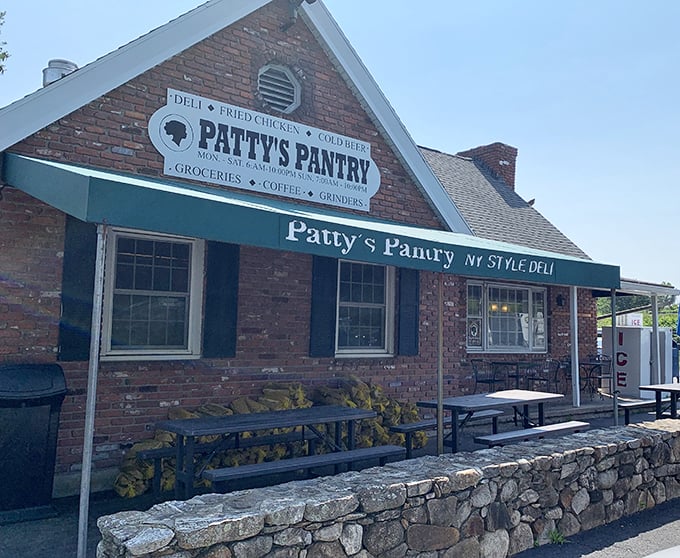 This charming brick building houses Patty's Pantry, where fried chicken dreams come true beneath that pitched roof.