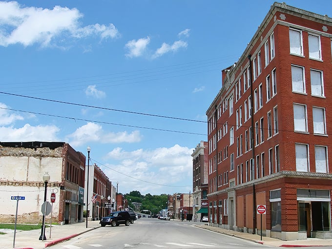 Downtown Pawhuska's historic brick buildings stand proudly against Oklahoma's endless blue sky, offering small-town charm with big character.