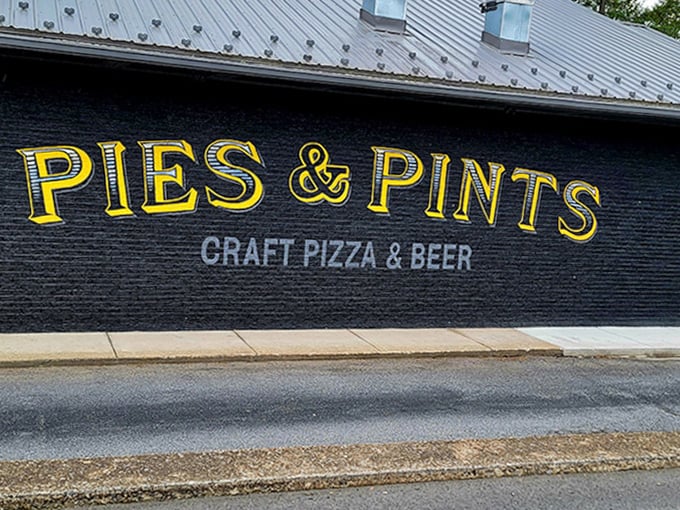 Bold yellow letters against dark walls &ndash; like a beacon calling all pizza lovers to experience craft pizza perfection.