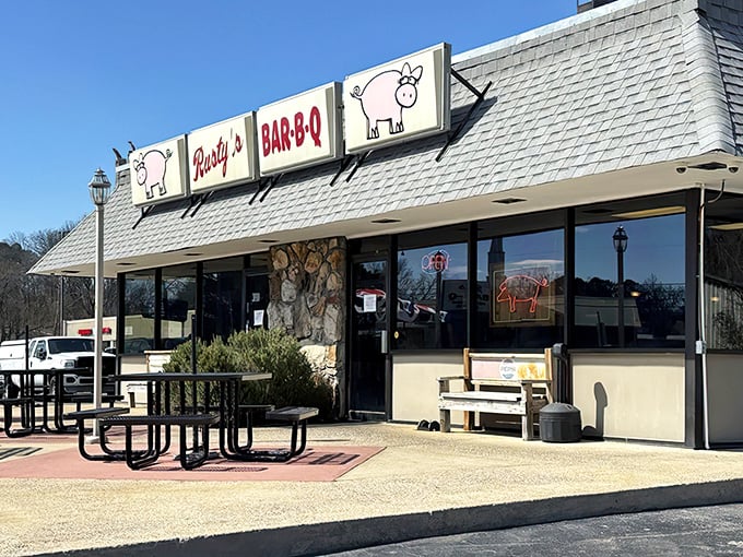 Rusty's pink pig signs aren't just cute&mdash;they're a promise of pork perfection waiting beneath that charming shingled roof.