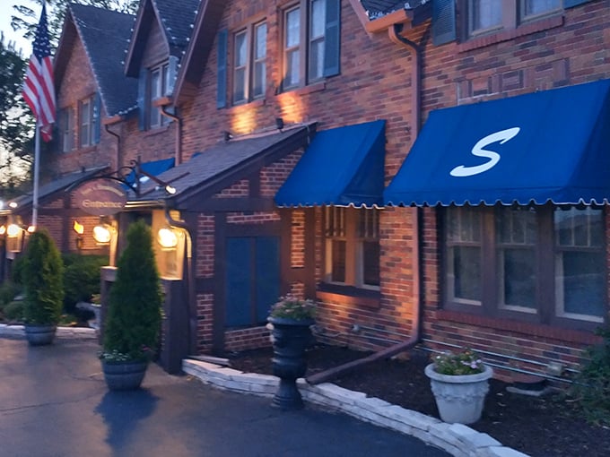 Twilight transforms Sam's brick exterior into a beacon for meat lovers. Those blue awnings have sheltered generations of happy diners.