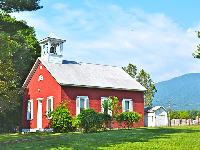 This red barn could star in every farm calendar ever made, complete with authentic countryside charm.