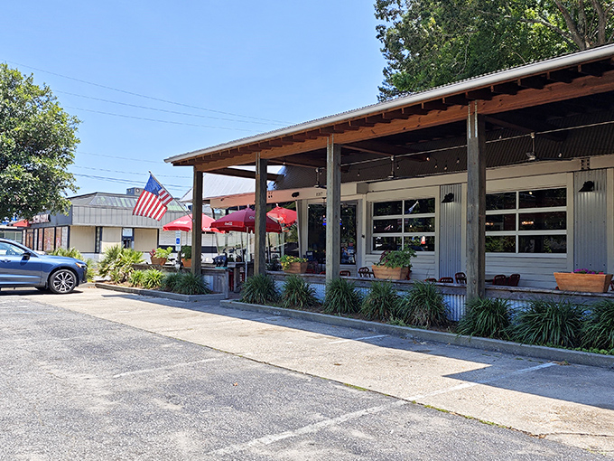 Strings of lights welcome you to Swig & Swine's outdoor space. Where conversations flow as freely as the sweet tea and smoky aromas.