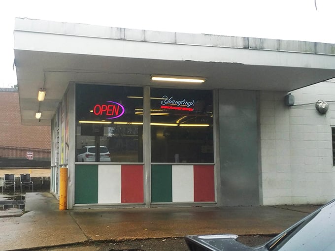 Small but mighty, The Pizza Shack's humble exterior hides big flavors. That neon "OPEN" sign might as well say "HEAVEN"!