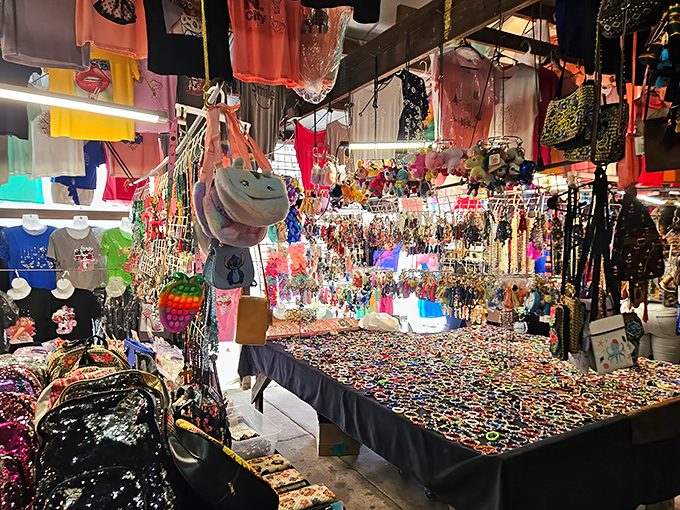A kaleidoscope of colors greets shoppers at this indoor vendor's booth. Like walking into a jewelry box explosion!