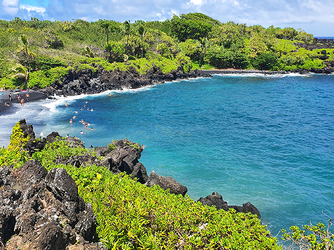 Black sand meets brilliant blue at Waiʻānapanapa's famous beach. Even the fish probably stop to admire this view!