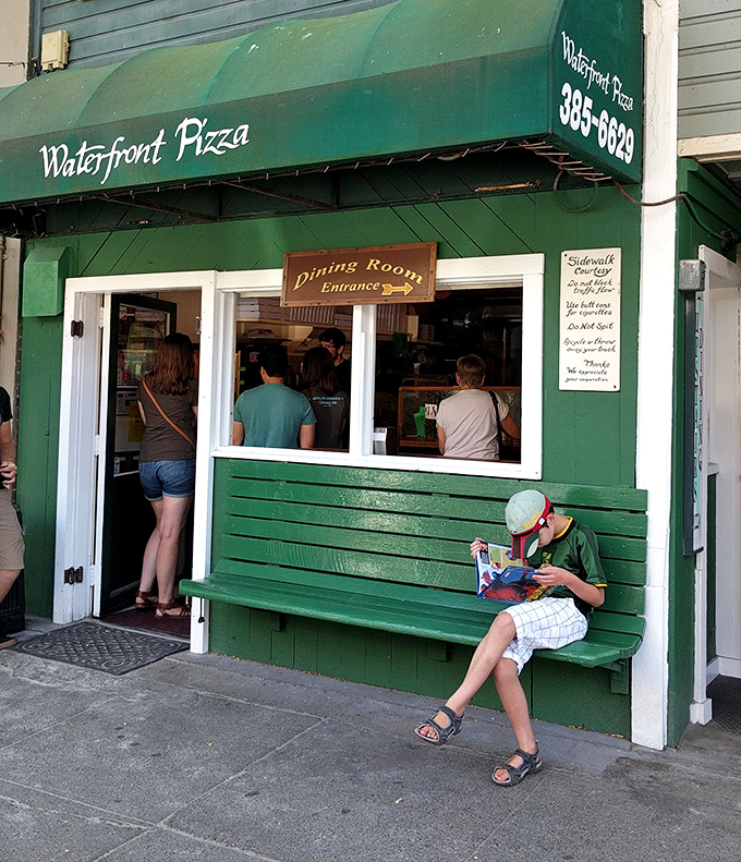 "Dining Room Entrance" points the way to pizza nirvana. Sometimes the simplest places hide the most extraordinary flavors.
