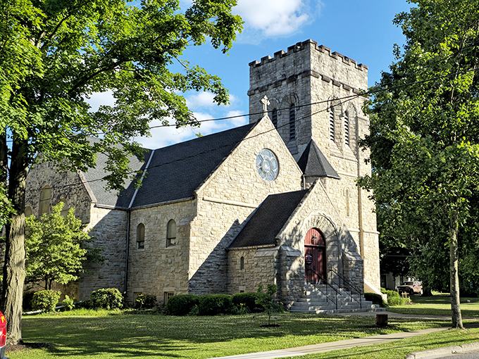The historic church spire punctuates Wellsboro's skyline, while stone buildings line streets that haven't changed much in a century.